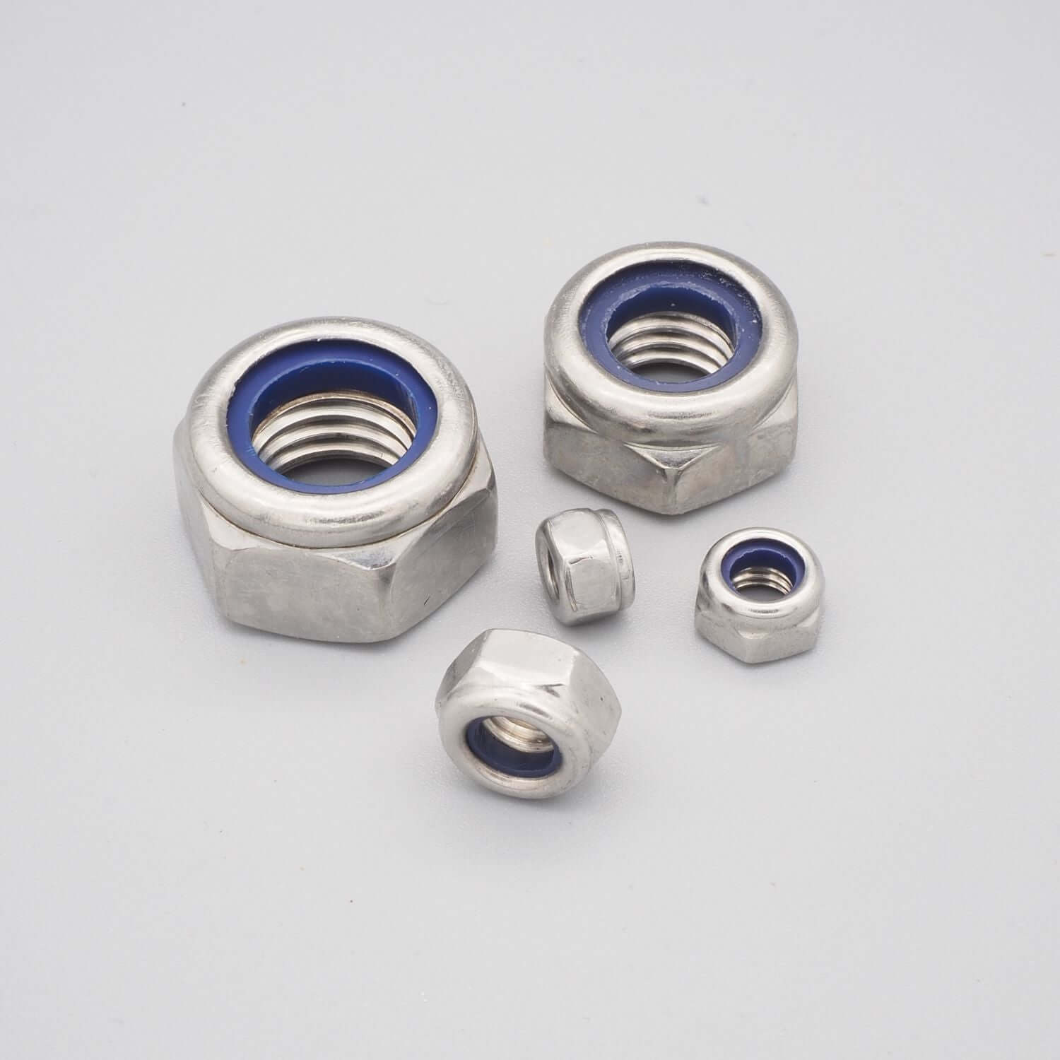 Syrafast låsmutter DIN 985 – låg modell i rostfritt A4